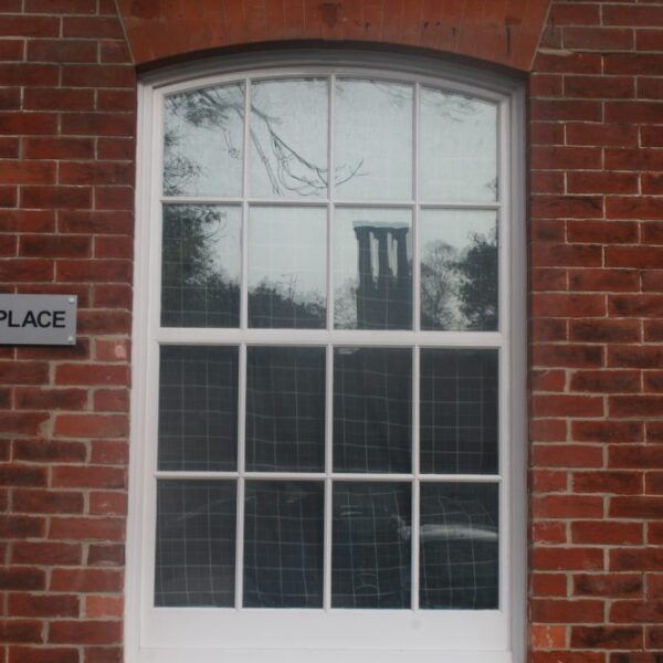 Casement windows and round window in Church Hall - Medina Joinery